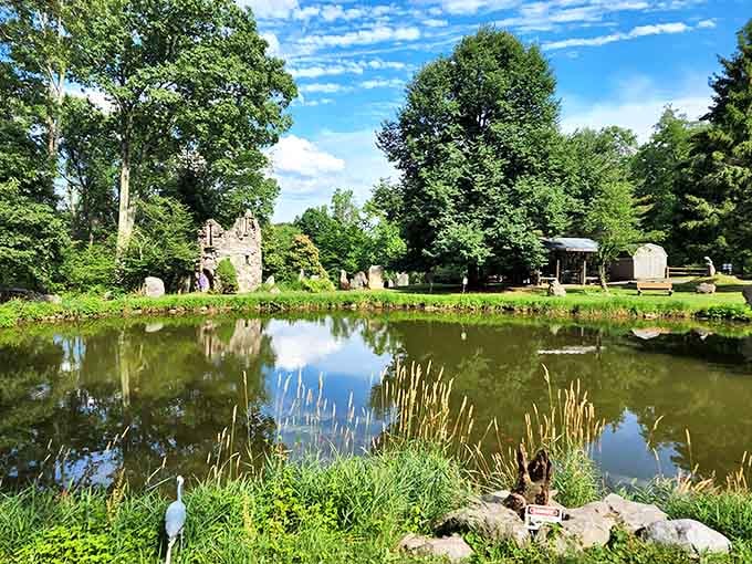 Ancient stones reflect perfectly in still waters, creating a mirror image that doubles the magic of this serene spot.
