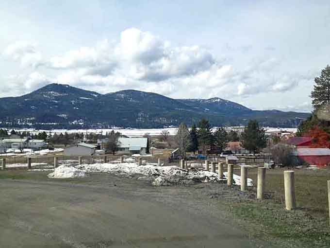 Main Street stretches wide and welcoming, where mountains frame your everyday errands like a postcard come alive.