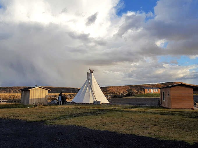 A lone teepee stands against the high desert sky, reminding visitors that simplicity has its own rewards.