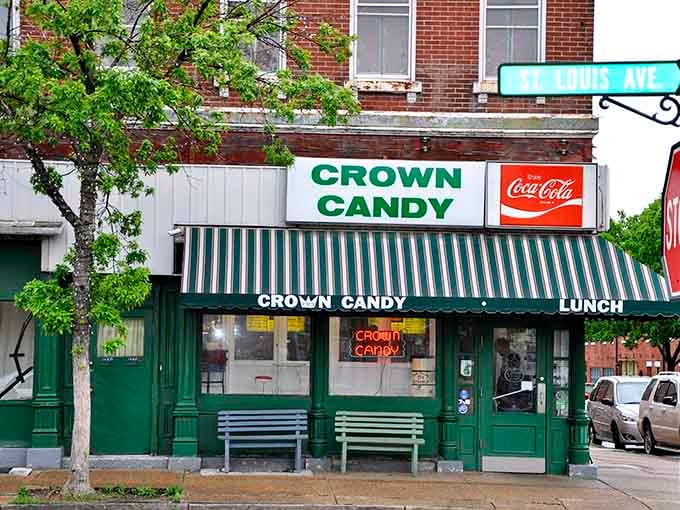 Green and white striped awning over classic storefront&mdash;this old-fashioned candy kitchen looks like a Norman Rockwell painting come to life.