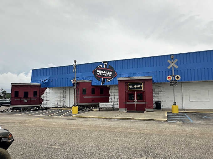 The bright blue building with actual railroad cars attached proves that sometimes the quirkiest places serve the most memorable desserts.