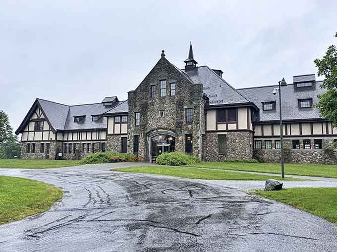 The grand Tudor-style estate stands timelessly elegant, its stone and timber facade whispering stories of American innovation.