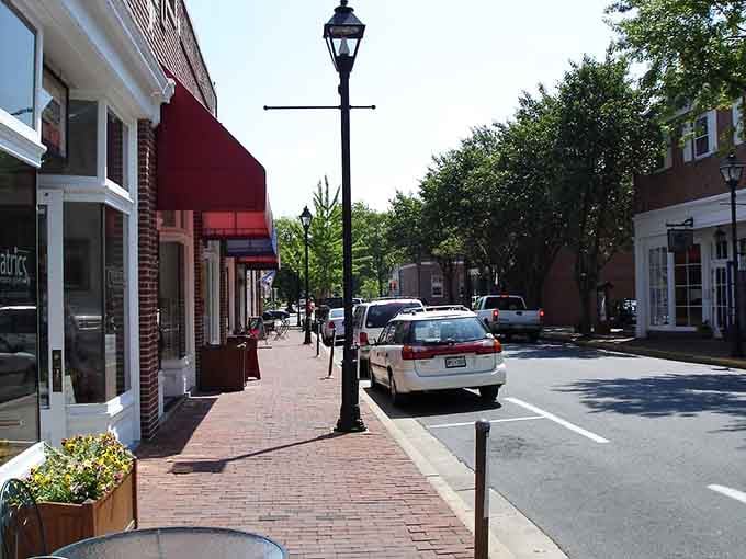 Brick sidewalks and gas-style streetlamps create an atmosphere where time slows down to a pleasant stroll.