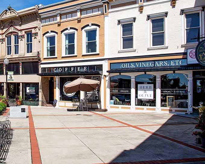 Sunlight catches storefront windows perfectly, illuminating the kind of specialty shops that make browsing an actual pleasure.