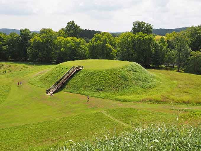 This grass-covered pyramid rises from the earth, a testament to the skilled hands that built it centuries ago.