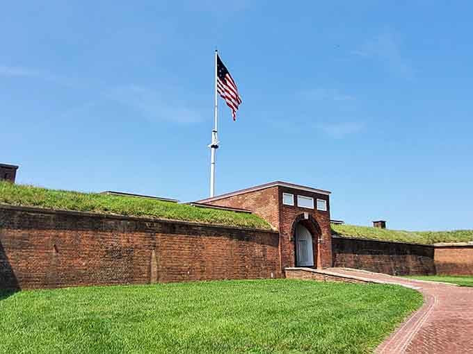 Brick fortress stands guard over the harbor, its grassy ramparts holding stories of courage that inspired our national anthem.