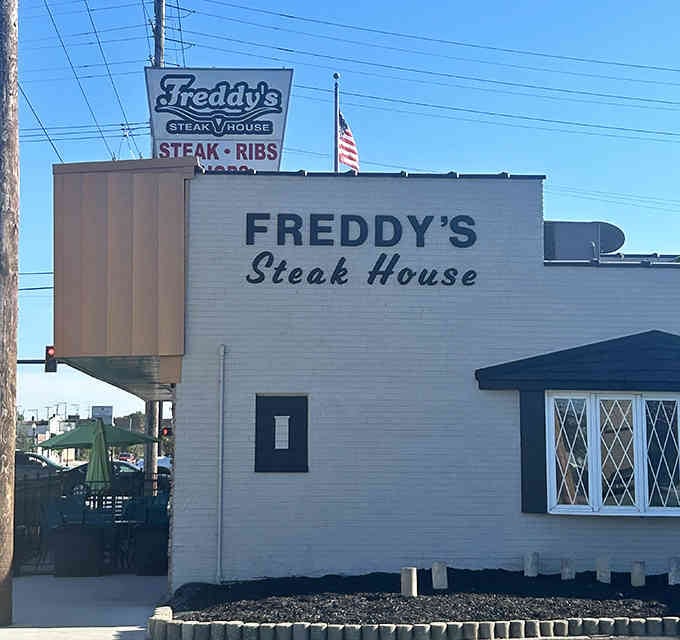 That vintage sign and classic white exterior whisper of simpler times when a great steak was all you needed.