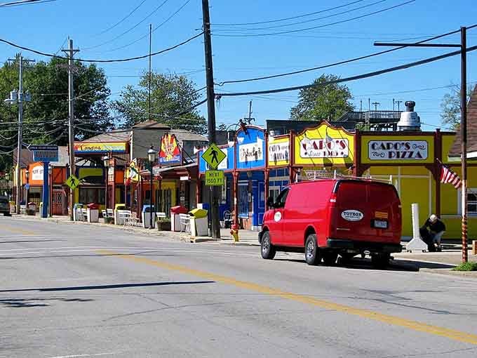 Colorful storefronts pop like a carnival midway, promising foot-long hot dogs and nostalgia in equal measure.