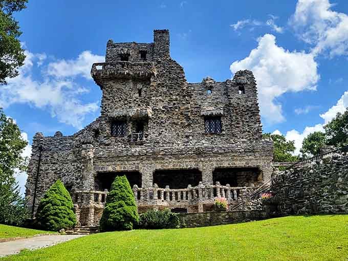 This stone fortress rises from the hillside like something straight out of a medieval fantasy brought to life.