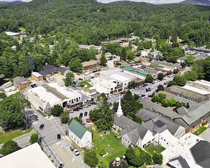 Green mountains embrace this compact downtown where church steeples still define the skyline instead of cell towers.