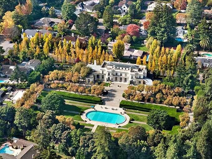 That sparkling pool nestled among manicured lawns proves elegance doesn't need to shout when it's surrounded by such tranquility.