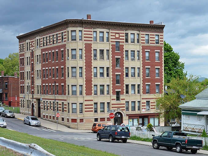 This striped brick beauty stands proud like a layer cake that's weathered a century of New England seasons.