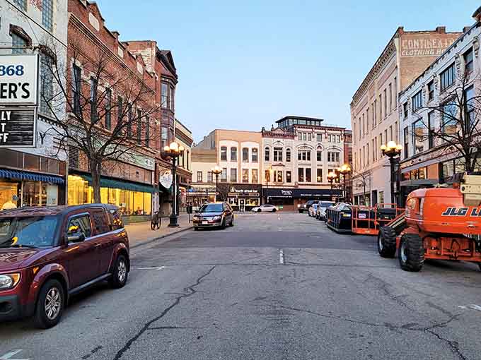 Downtown La Crosse glows at dusk, where historic brick buildings hold stories and tomorrow's adventures waiting inside.