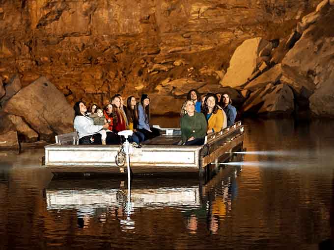 Underground boat tours glide through glowing emerald waters, turning a simple cave into an otherworldly voyage.