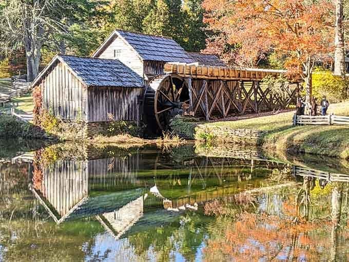 That weathered water wheel still turns beside the mill pond, creating reflections so perfect they rival any mirror.