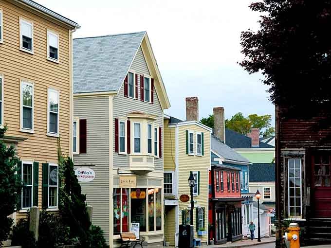 Houses painted in cheerful colors huddle together on narrow streets like they're sharing century-old secrets and gossip.