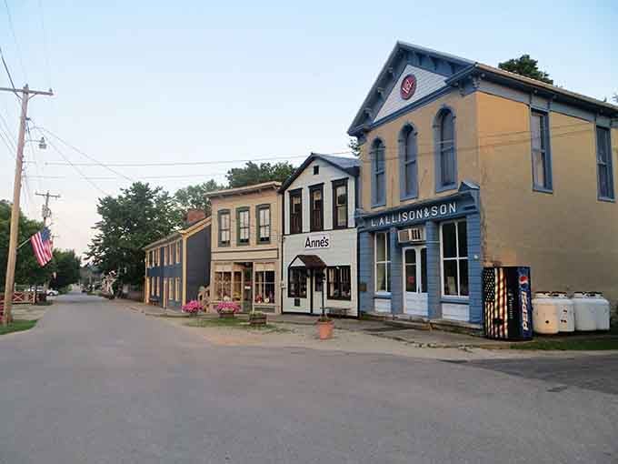 Metamora's painted storefronts stand proudly along the quiet street like characters in a storybook.