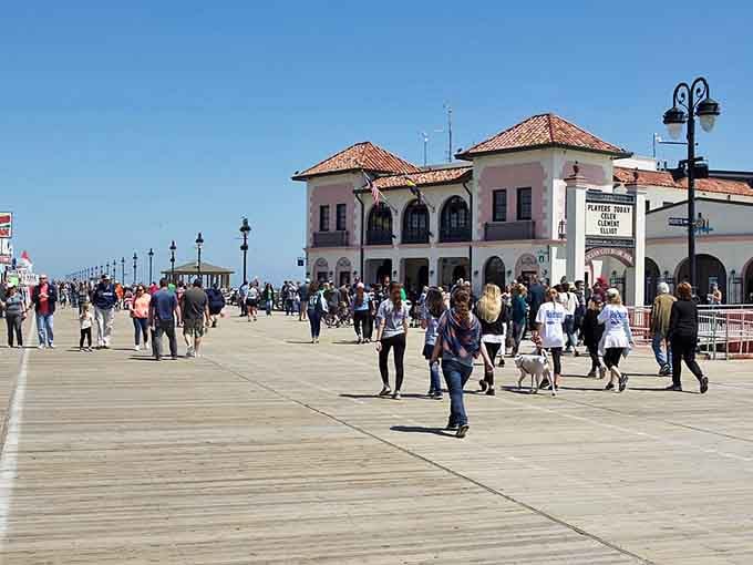 The Ocean City boardwalk buzzes with families enjoying salt air, sunshine, and the simple pleasure of a stroll.