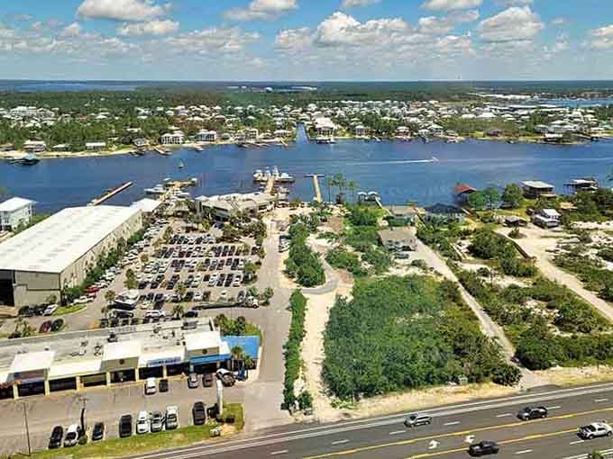 Waterfront living meets coastal charm where boats bob gently and palm trees sway like they're keeping time with waves.