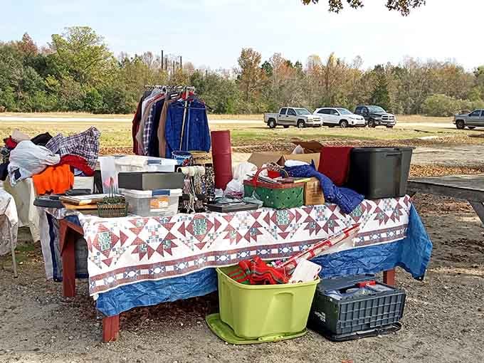 A handmade quilt drapes over household treasures, blending grandma's craft fair with modern bargain hunting perfectly.