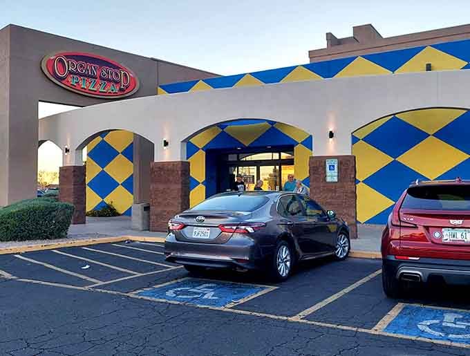 Those bold blue and yellow diamonds practically shout "Come inside for pizza and a show you won't forget!"