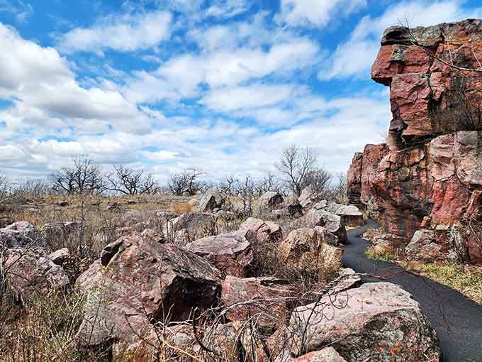 Ancient pink quartzite formations rise from prairie earth like nature's own cathedral, weathered by countless seasons and ceremonies.