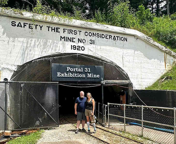 That stark white entrance portal cuts into the mountainside like nature's own subway station, promising underground adventures ahead.