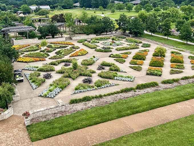 Geometric garden beds create living artwork, each section bursting with carefully planned color and texture.