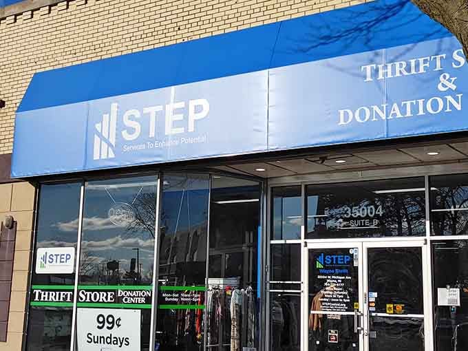 The crisp blue awning and modern signage promise organized aisles where every item supports neighbors reaching their potential.