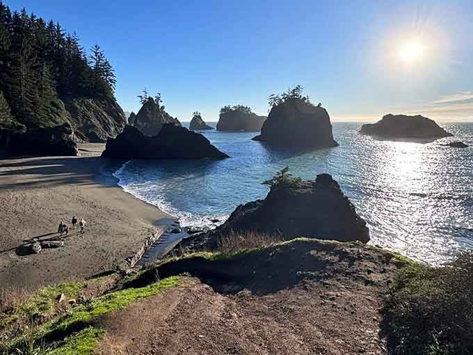 The dramatic sea stacks stand tall against the sparkling ocean, offering an unforgettable coastal view.
