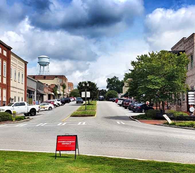 That water tower stands guard over Main Street like a friendly giant watching over the neighborhood.