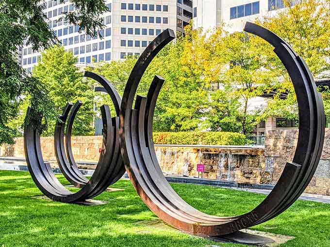 Curved black rings frame the cityscape beyond, turning ordinary views into artistic compositions worth photographing repeatedly.