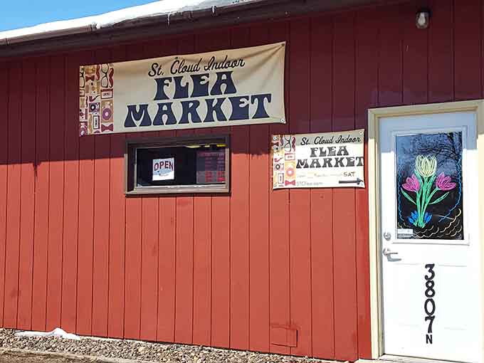 The classic red barn exterior with hand-painted signage feels like stepping back to simpler shopping times.