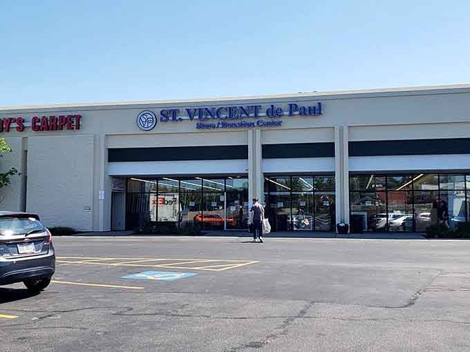 Clean storefront with generous glass windows lets sunshine pour in, making this charitable shop feel bright and inviting.