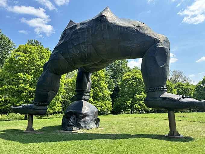 Now that's what you call thinking outside the box! This massive headstand sculpture defies gravity beautifully.