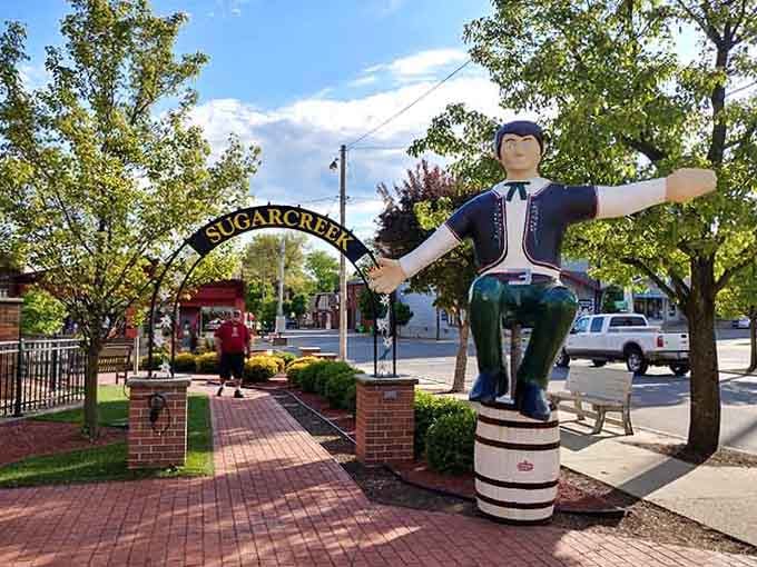 This cheerful fellow sitting on a barrel welcomes you to a town that celebrates its heritage with humor.