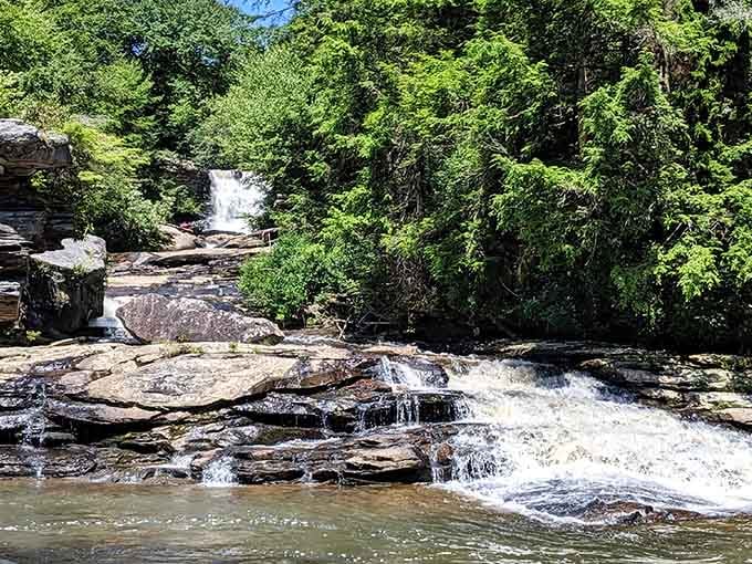 Water cascades over ancient rocks in layers, creating nature's own staircase that's been flowing since your grandparents were kids.