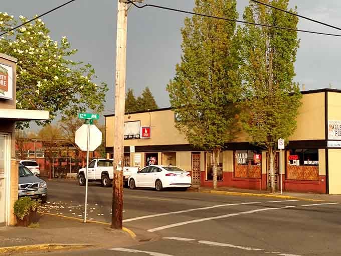 Autumn light bathes the storefronts in that golden glow photographers pay thousands for but residents enjoy free every evening.