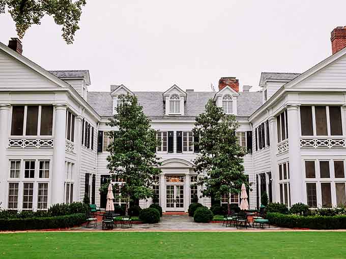 This pristine white mansion radiates Southern elegance, though some guests report experiencing more than just gracious hospitality here.