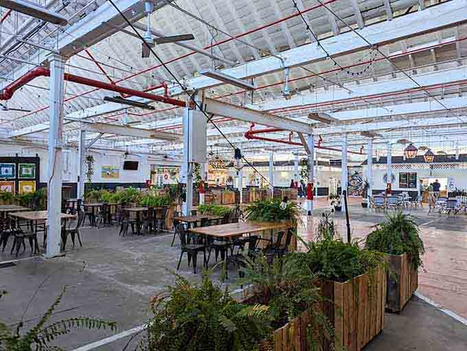 Industrial chic meets vintage charm with exposed beams and planters creating an unexpectedly stylish shopping atmosphere.