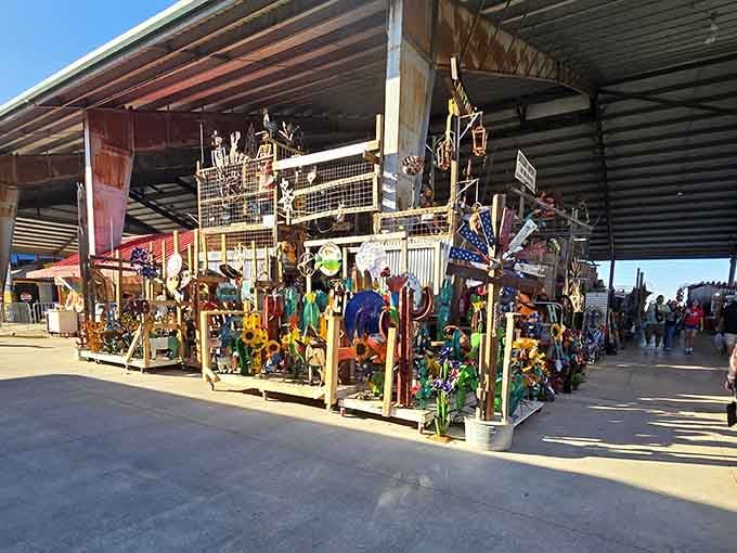 Garden art explodes in vibrant colors outside these vendor stalls, turning practical shopping into an unexpected outdoor gallery experience.
