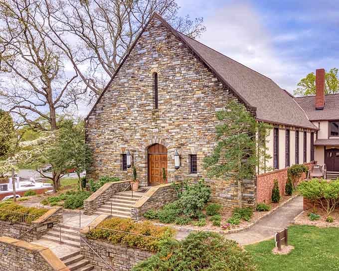 Stacked stone and arched doorways give this building the timeless appeal of an old European countryside chapel.