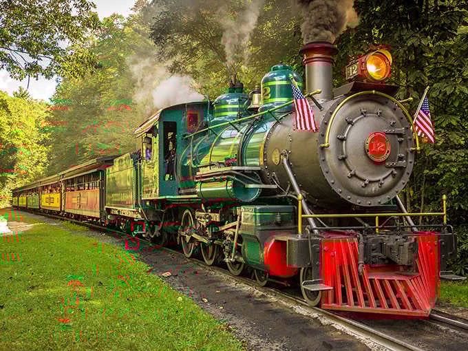 Steam billowing, flags flying, this turquoise and red beauty looks like it rolled straight out of a child's dream.