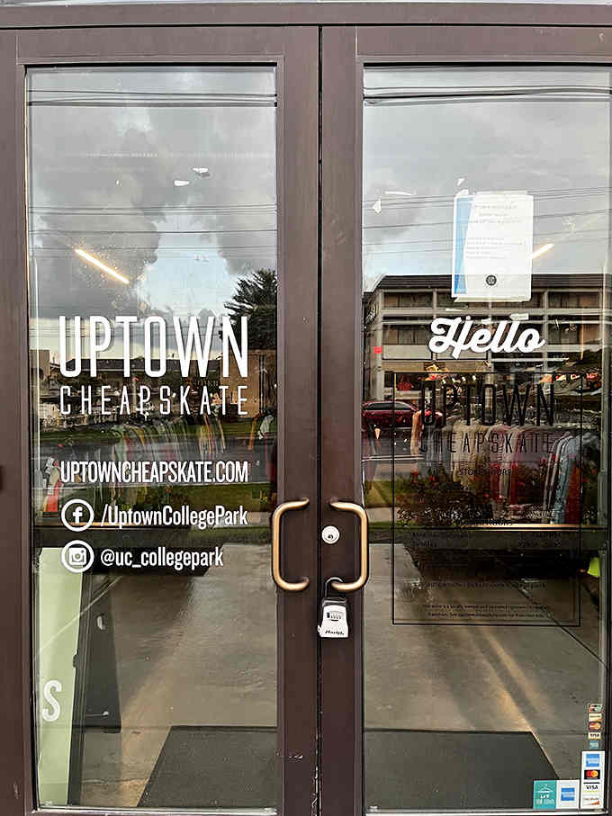 The glass door entrance whispers "hello" with modern lettering that makes thrifting feel surprisingly chic and contemporary.