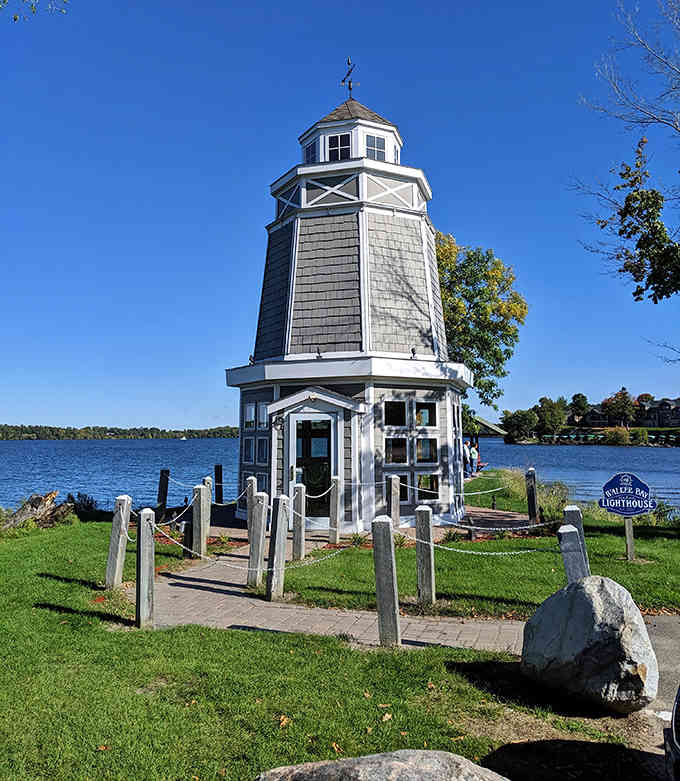 This petite charmer looks like a dollhouse come to life, its weathered shingles and white trim pure lakeside cottage magic.