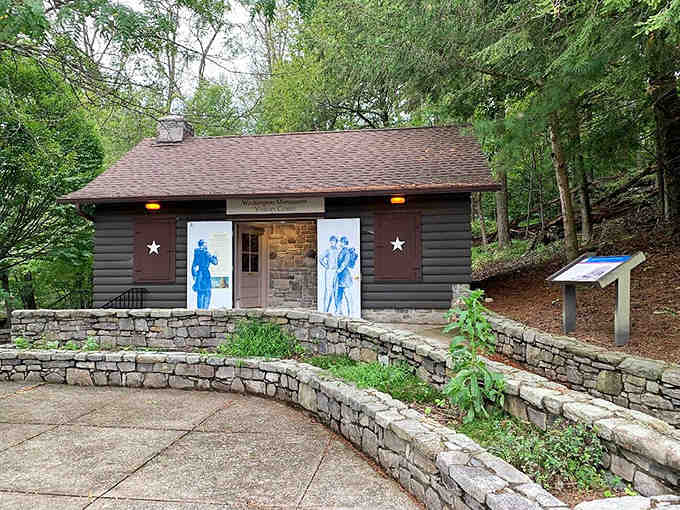 This rustic museum cabin sits nestled in the woods like something from a Thoreau daydream come to life.