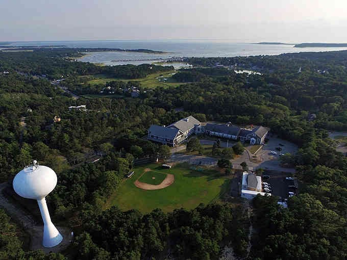 From above, the baseball diamond and water tower reveal a community built around recreation and togetherness.