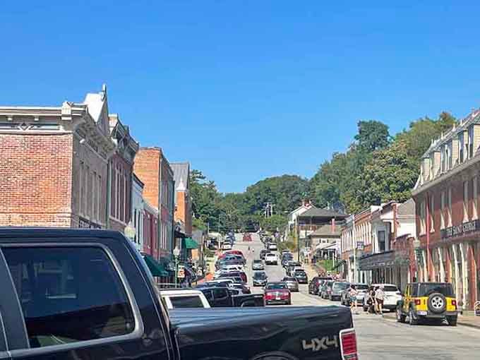 Main street stretches toward green hills in the distance, inviting you to slow down and actually enjoy the journey.