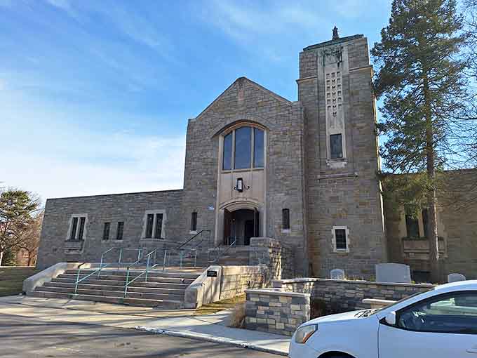The chapel's fortress-like stone walls and tower stand as solemn sentinels over countless stories carved in marble.