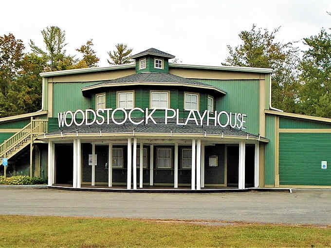 The Woodstock Playhouse stands ready for showtime, its green exterior as bold as the performances that happen inside those walls.